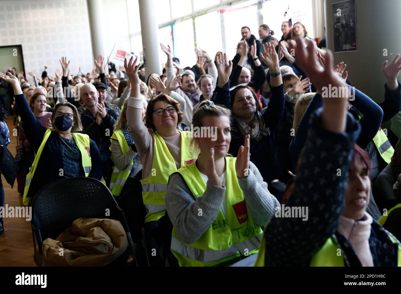 Berlin, Germany. 14th Mar, 2023. Participants in a strike meeting clap ...