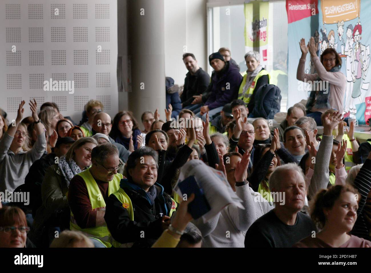 Berlin, Germany. 14th Mar, 2023. Participants in a strike meeting clap ...