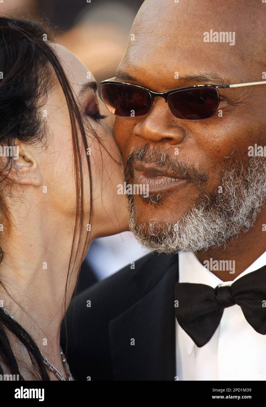 Italian actress Monica Bellucci, left, kisses American actor Samuel L ...