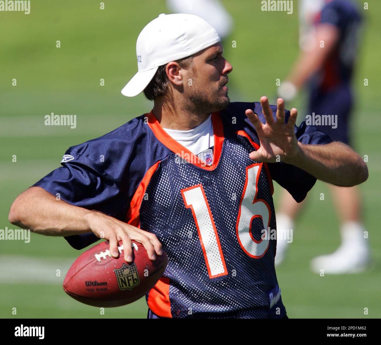 Denver Broncos quarterback Jake Plummer looks to throw during mini-camp ...