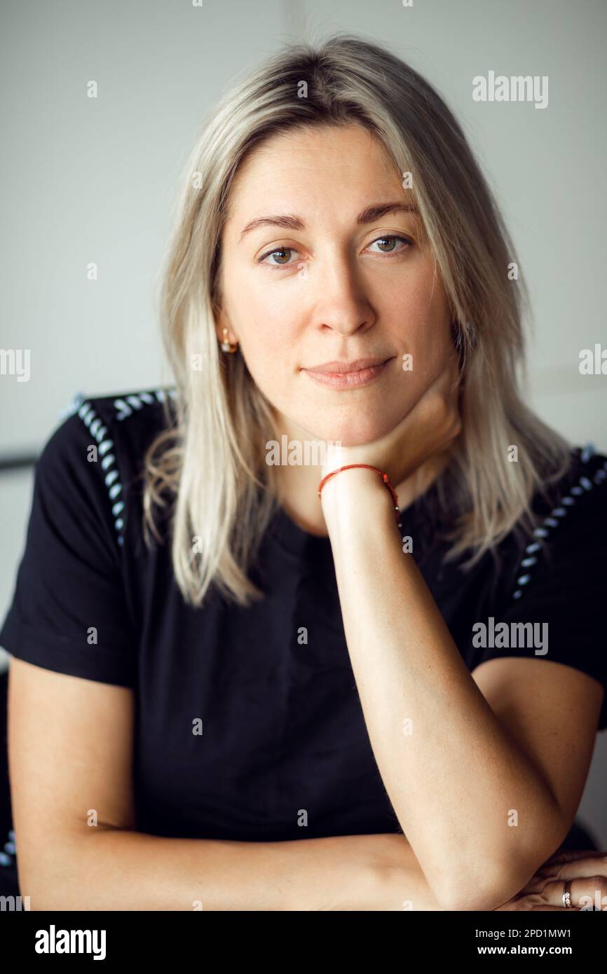 Close-up portrait of face of charming 40-year-old blonde with loose ...