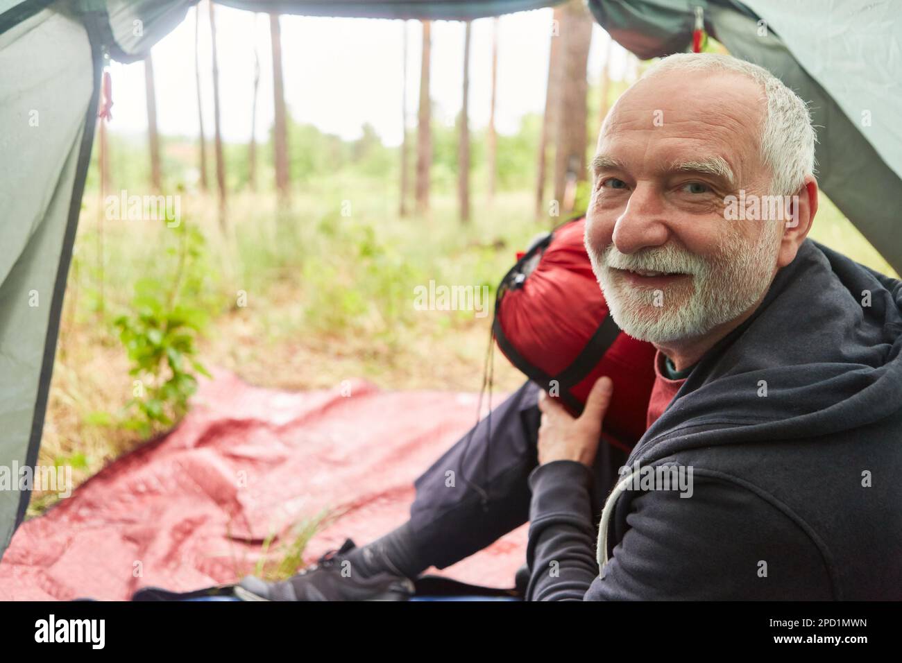 Camping man tent hi-res stock photography and images - Alamy