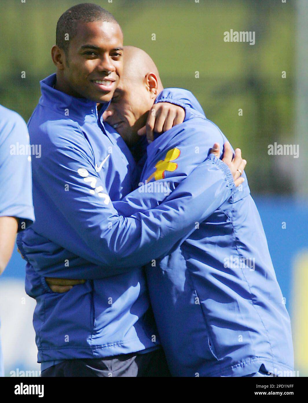 Brazil's player Robinho, left, hugs his teammate Roberto Carlos during ...