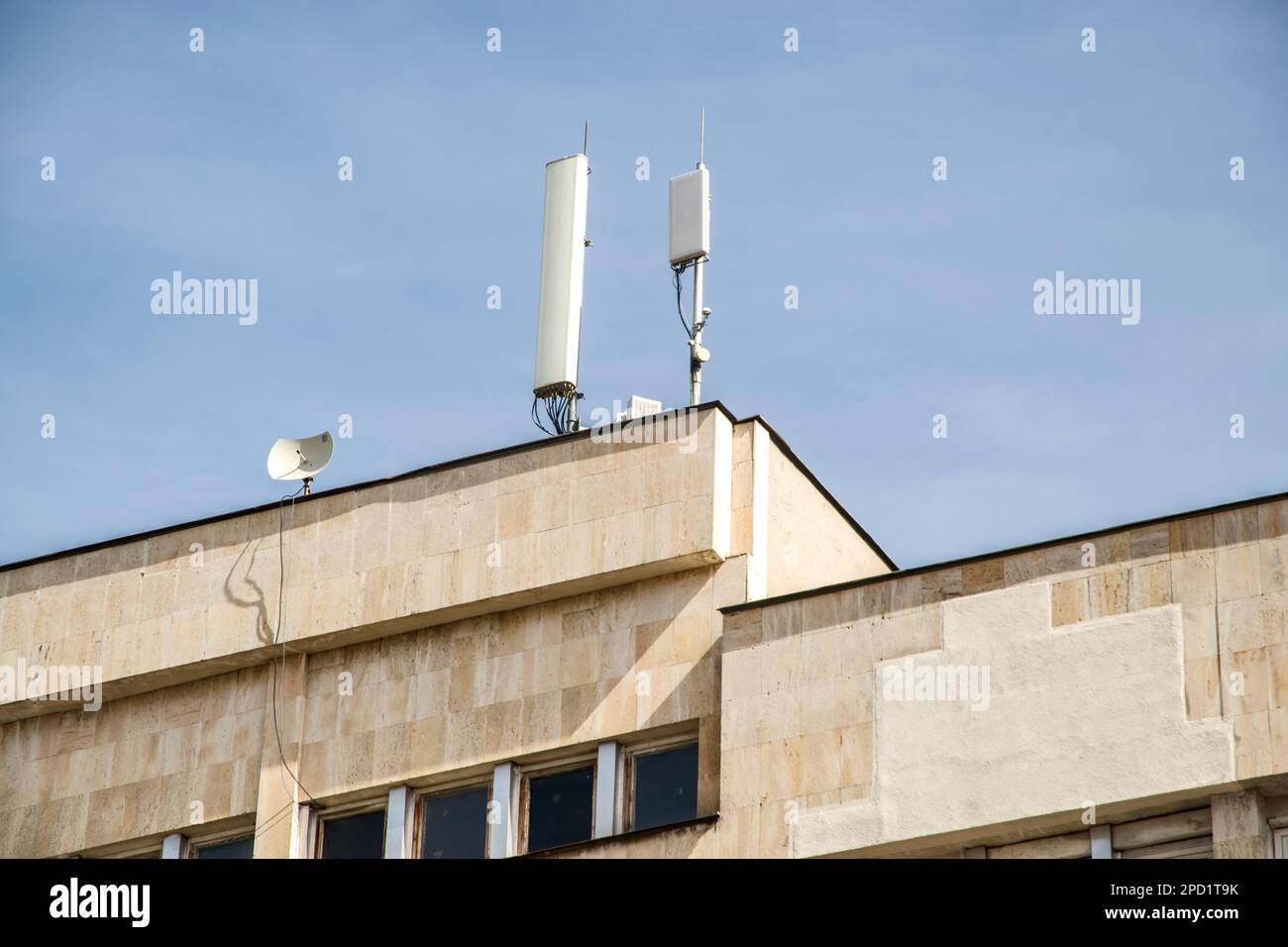 GSM cell phone antenna tower on rooftop Stock Photo - Alamy