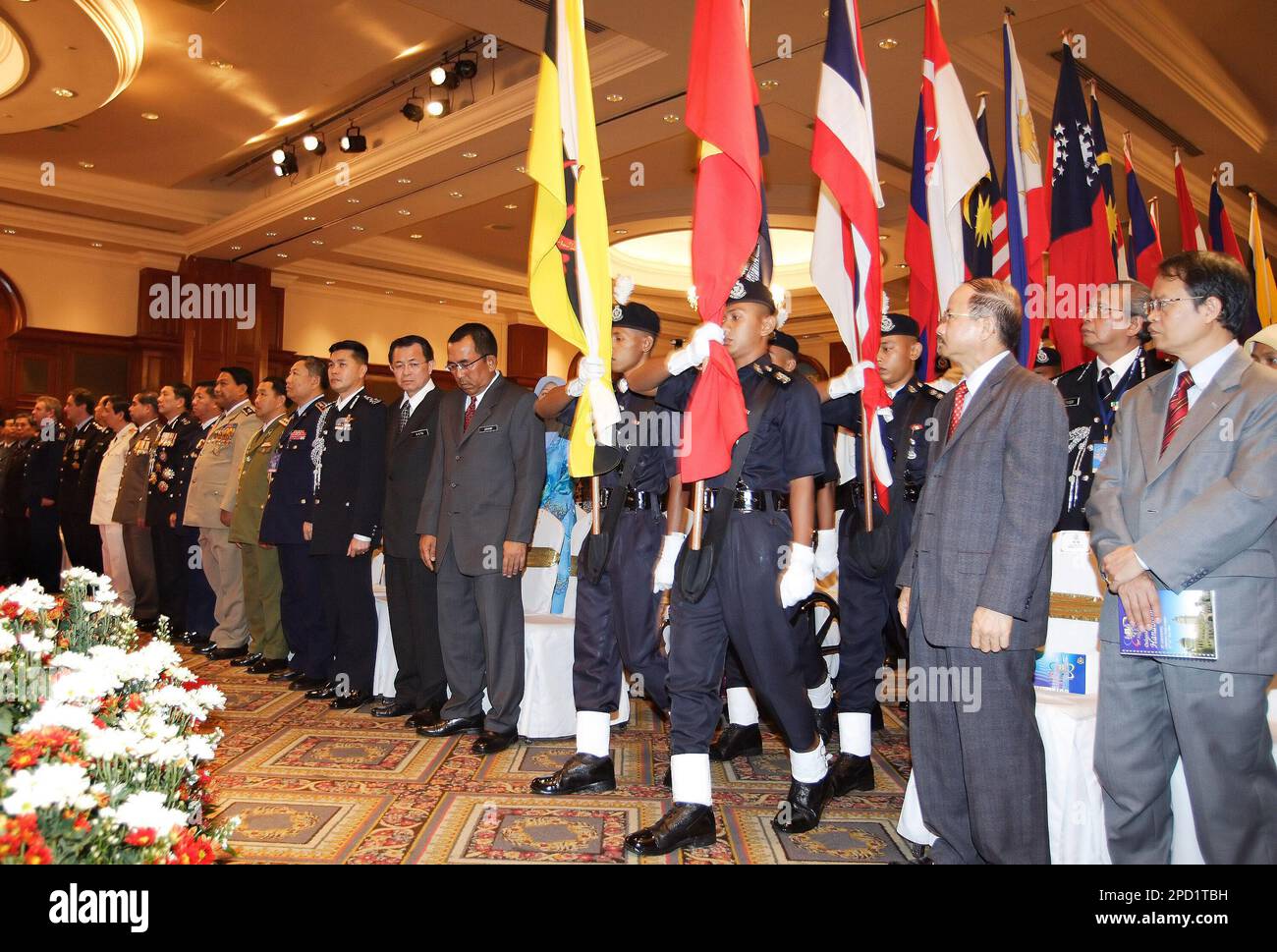 ASEAN Countries police chiefs, left, stand while Malaysian police ...