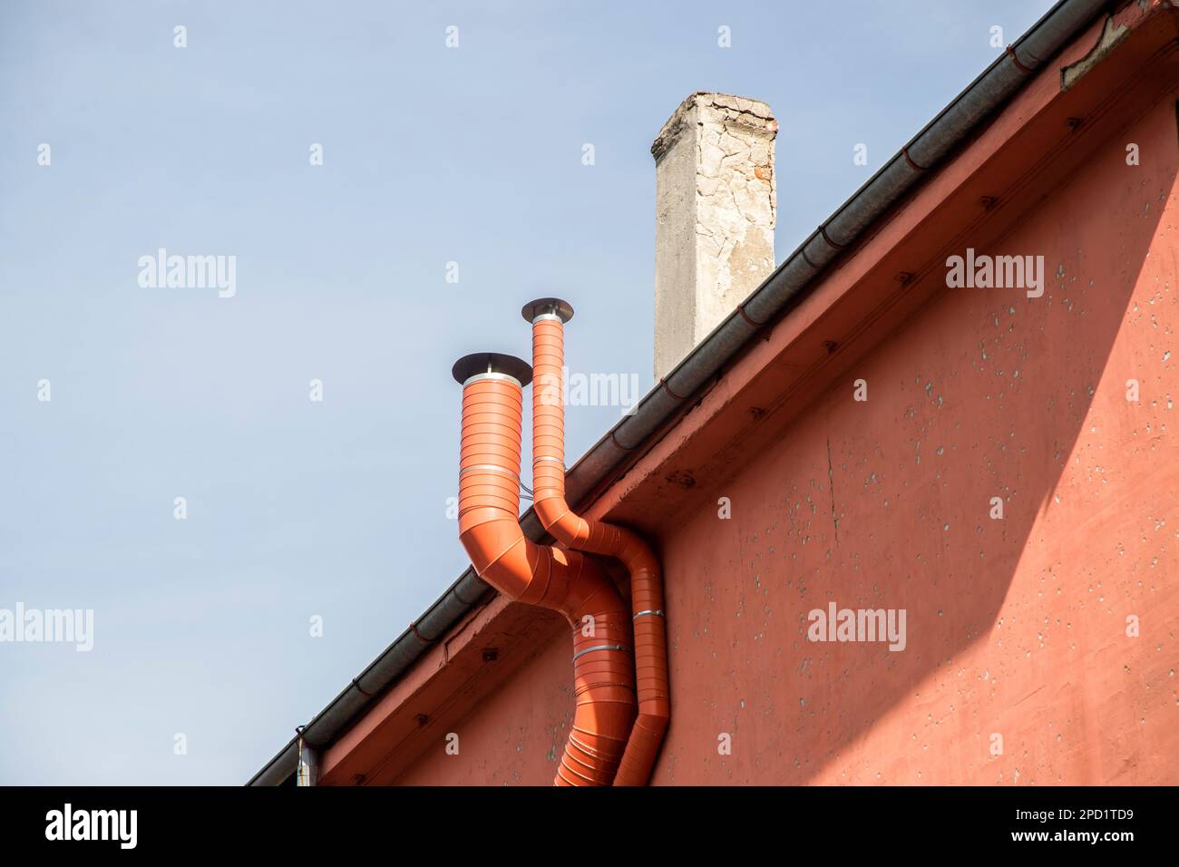 Air duct vent on the side wall of house closeup in clear sunny day ...