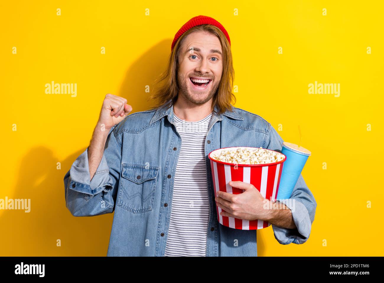 Photo of funny funky guy dressed jeans shirt rising fist going watching ...