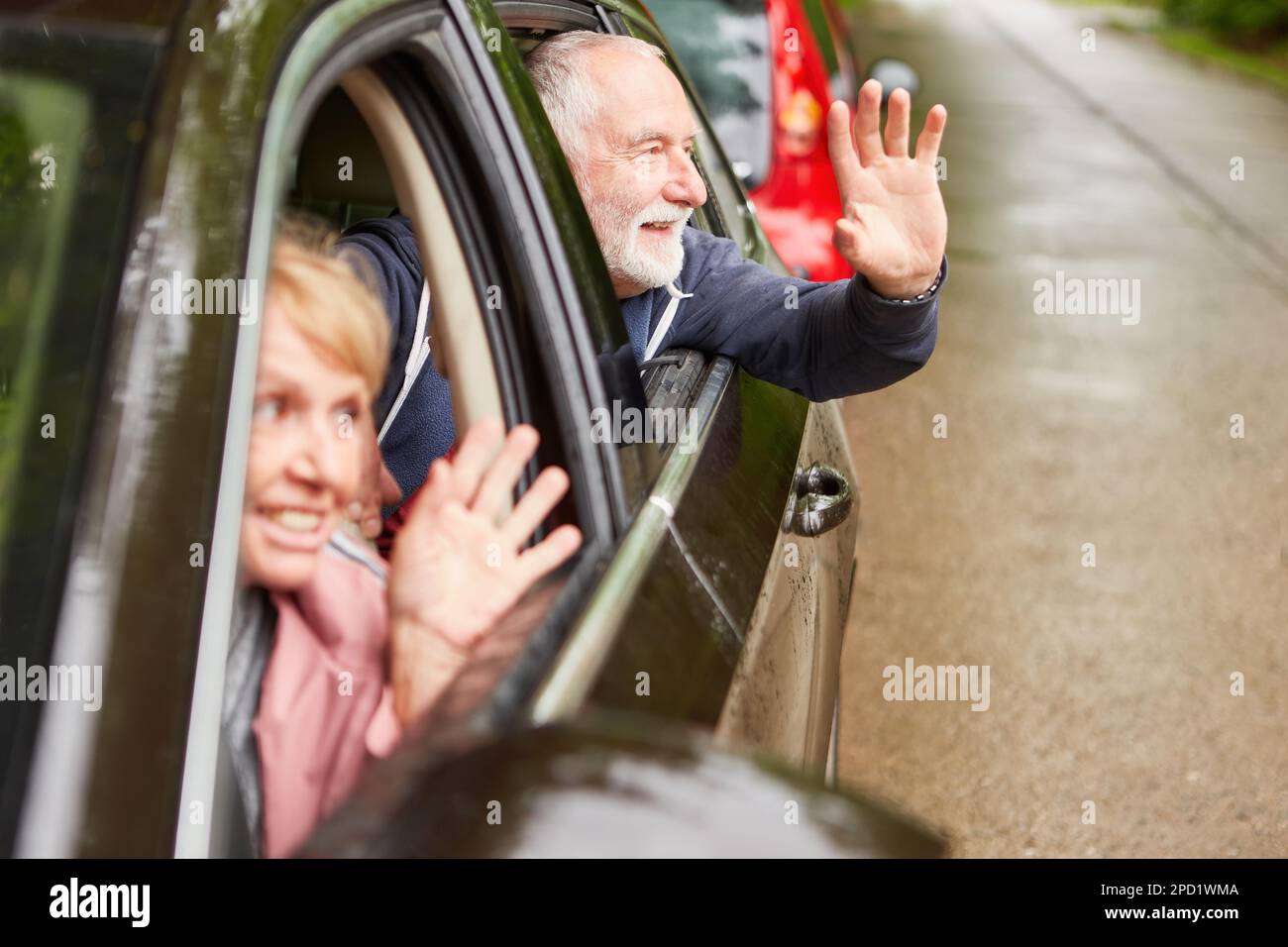 Woman waving window hi-res stock photography and images - Alamy