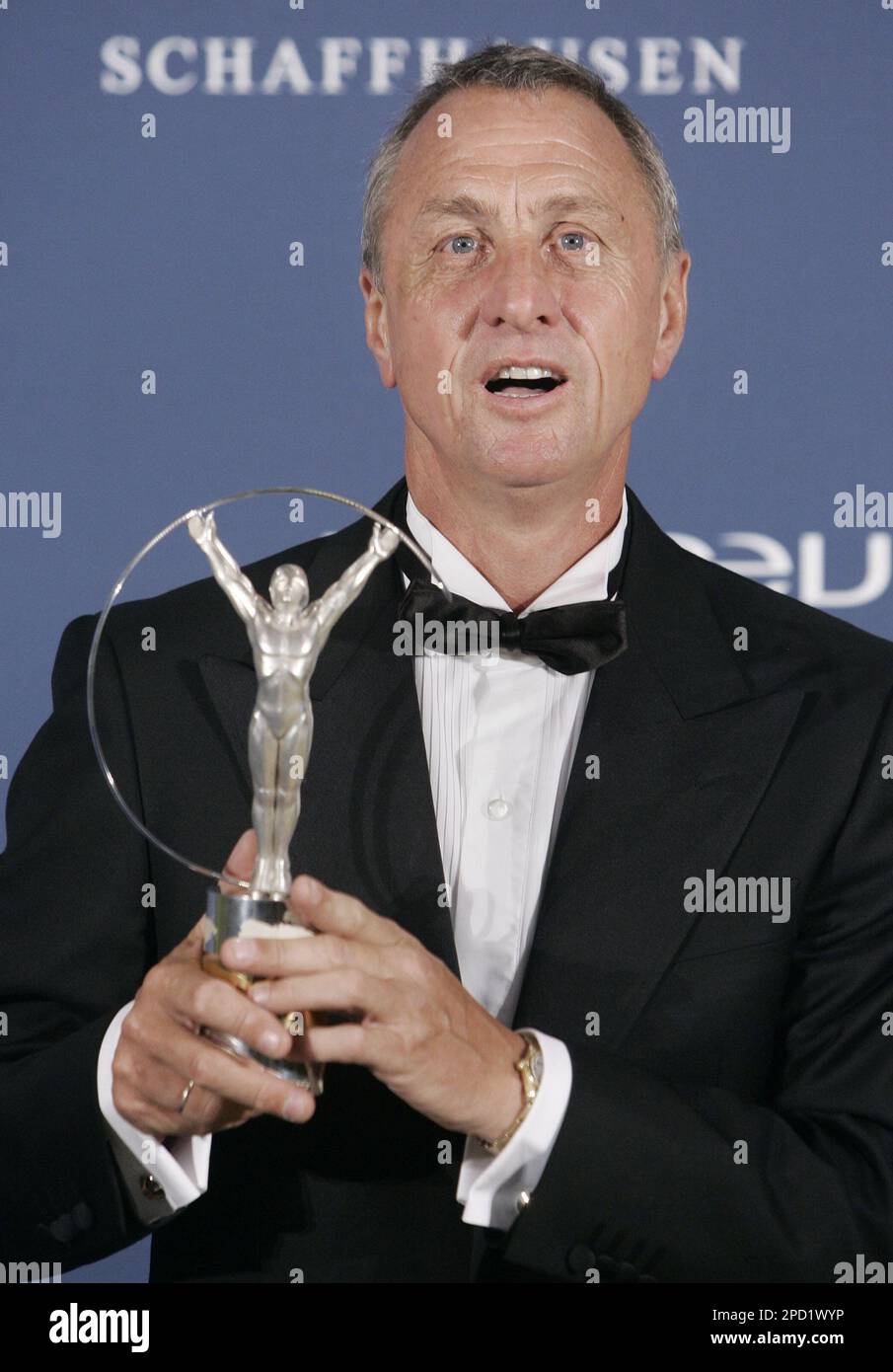 Dutch soccer legend Johan Cruyff holds his lifetime acheivement award ...