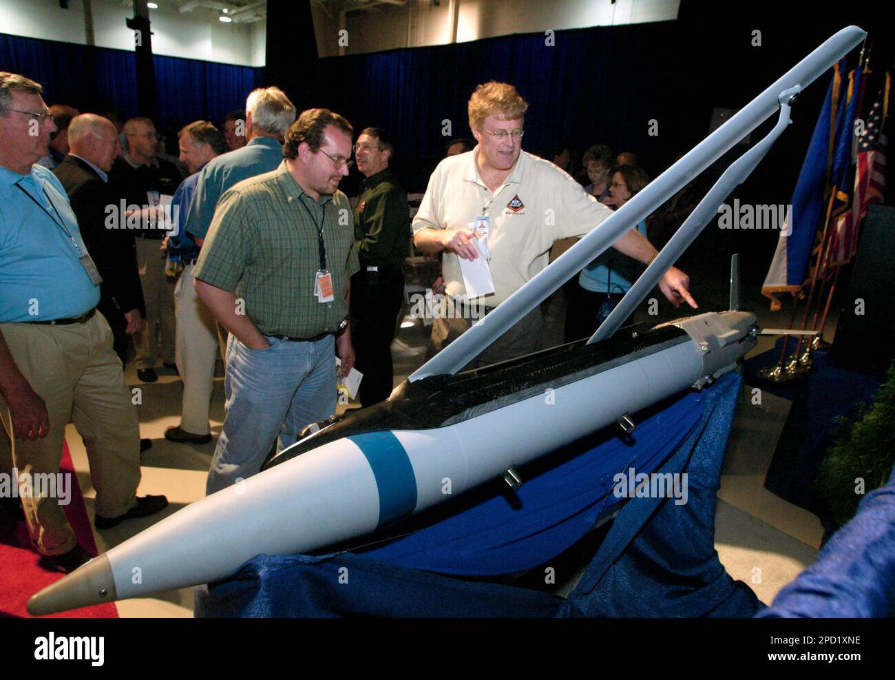 A member of the Boeing production team points out key components of a ...