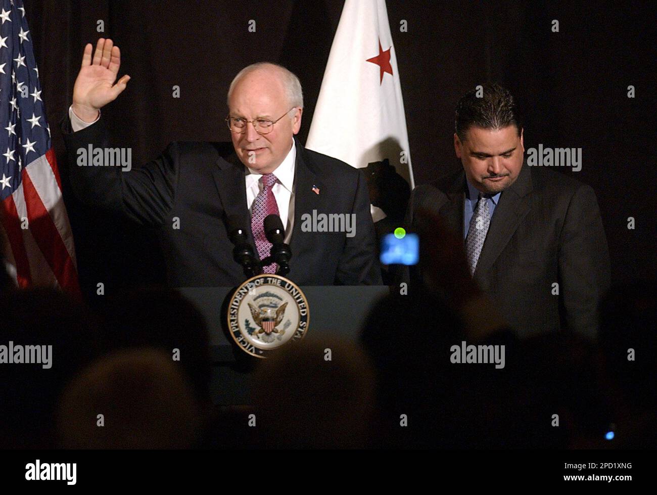 Vice President Dick Cheney, left, waves to supporters before speaking ...