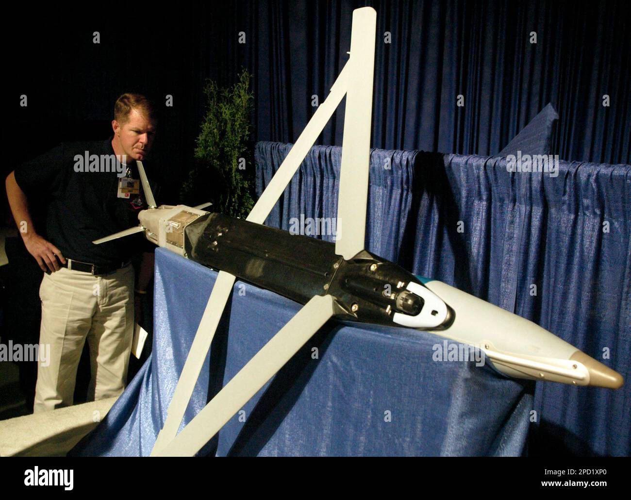 A guest inspects a new Boeing small-diameter bomb (SDB) in it's flight ...