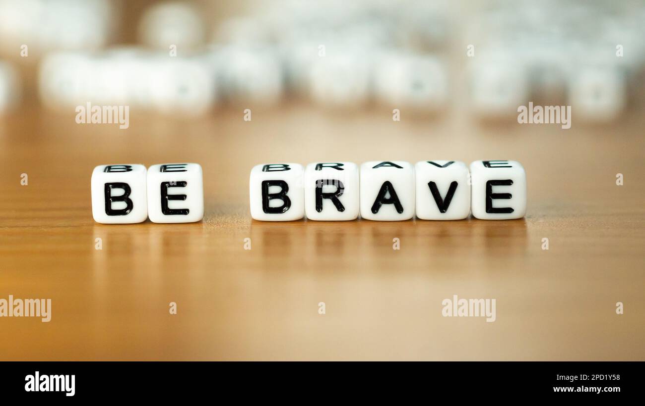 Be brave slogan in white block letter beads Stock Photo - Alamy