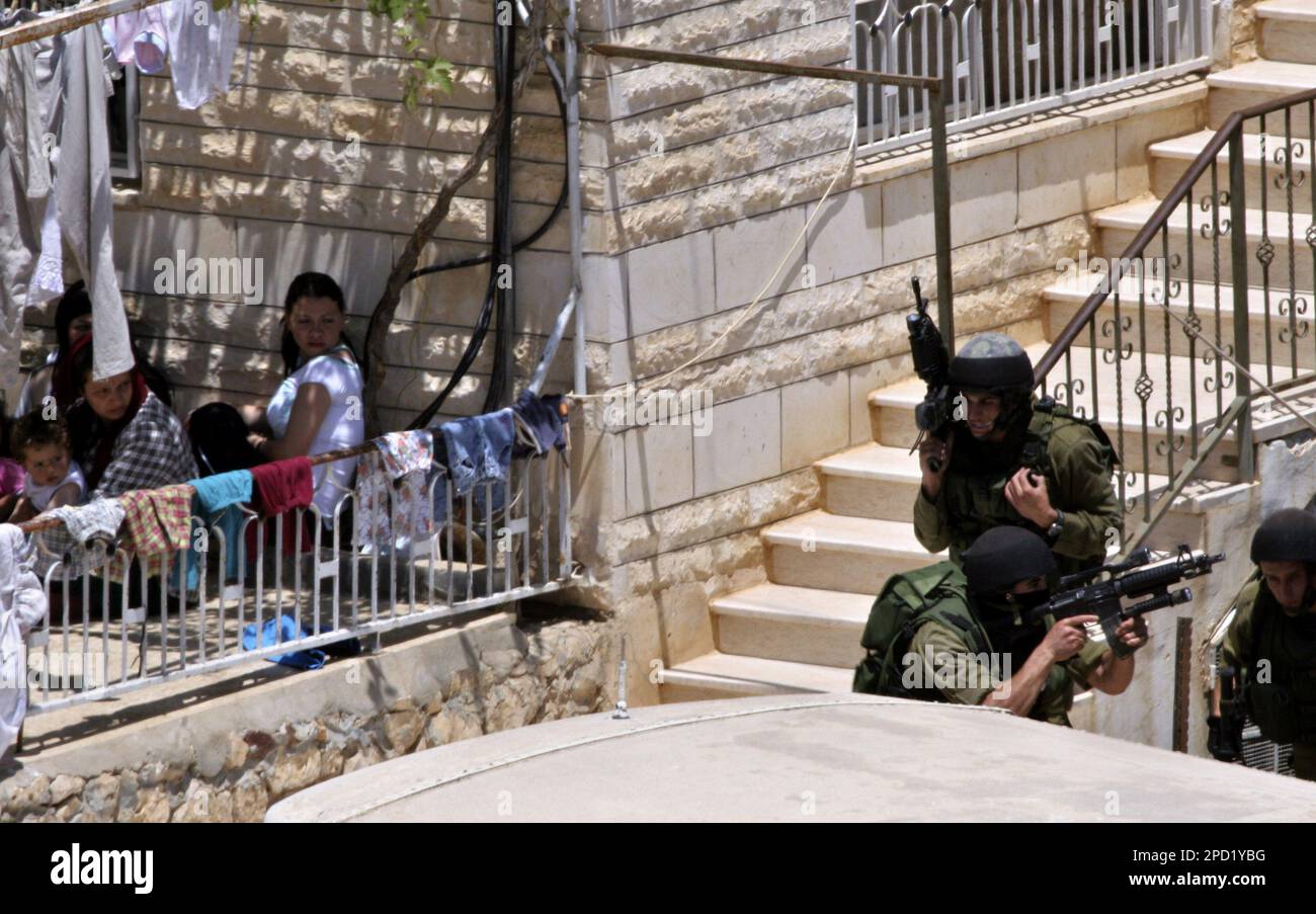 Israeli army soldiers operate in the West Bank village of Al-Zababdeh ...