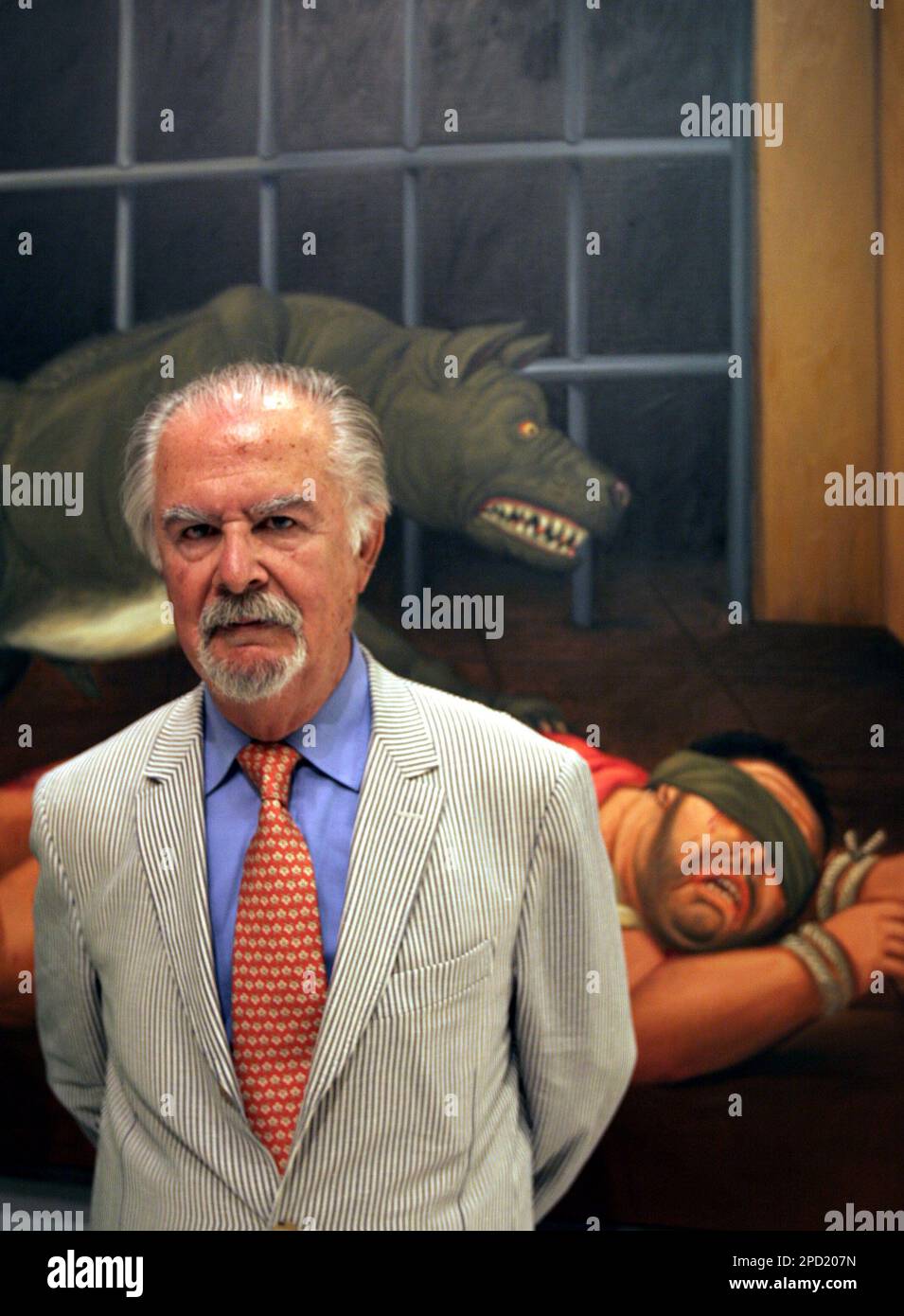 Colombian artist Fernando Botero poses in front of one of his paintings ...