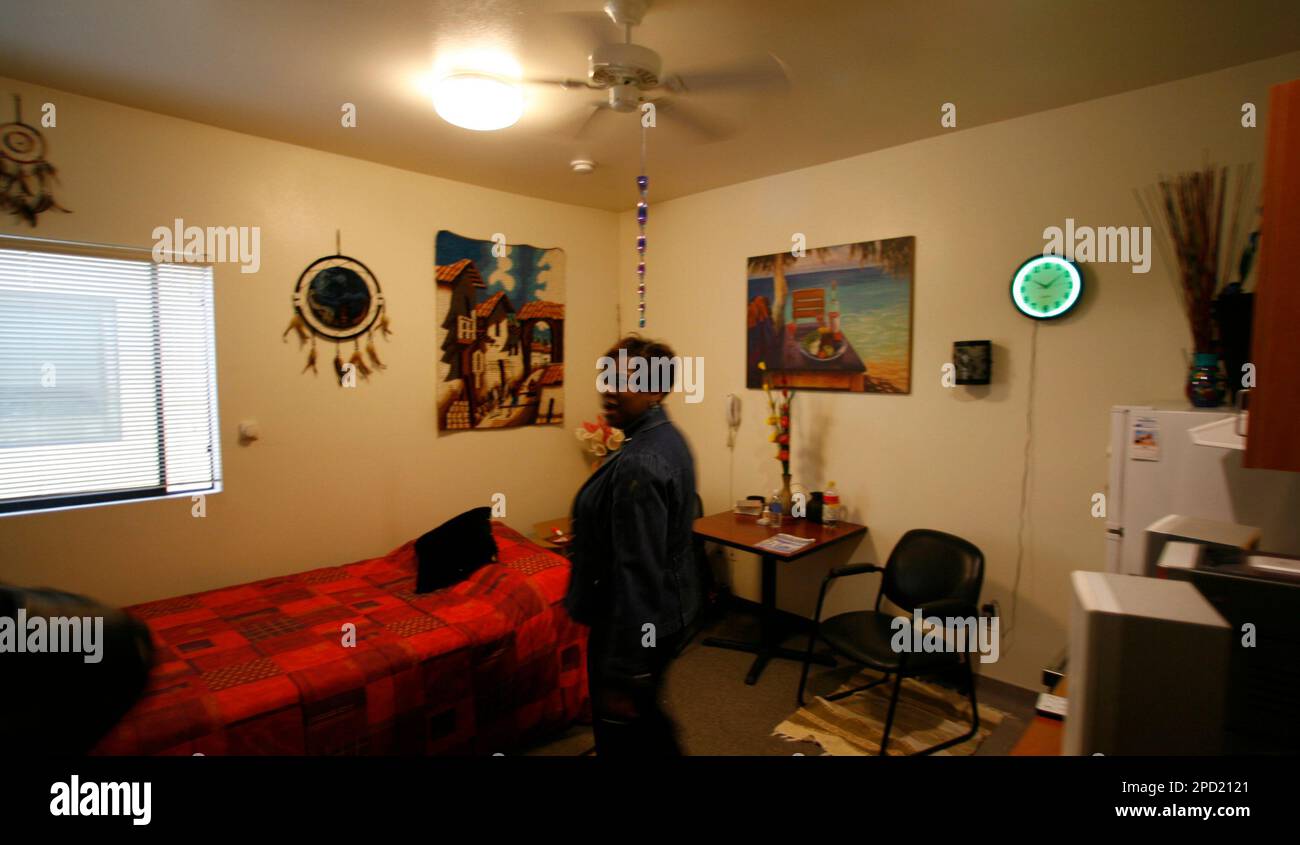 Anita Nelson, CEO of the SRO Housing Corp., poses inside a single room ...