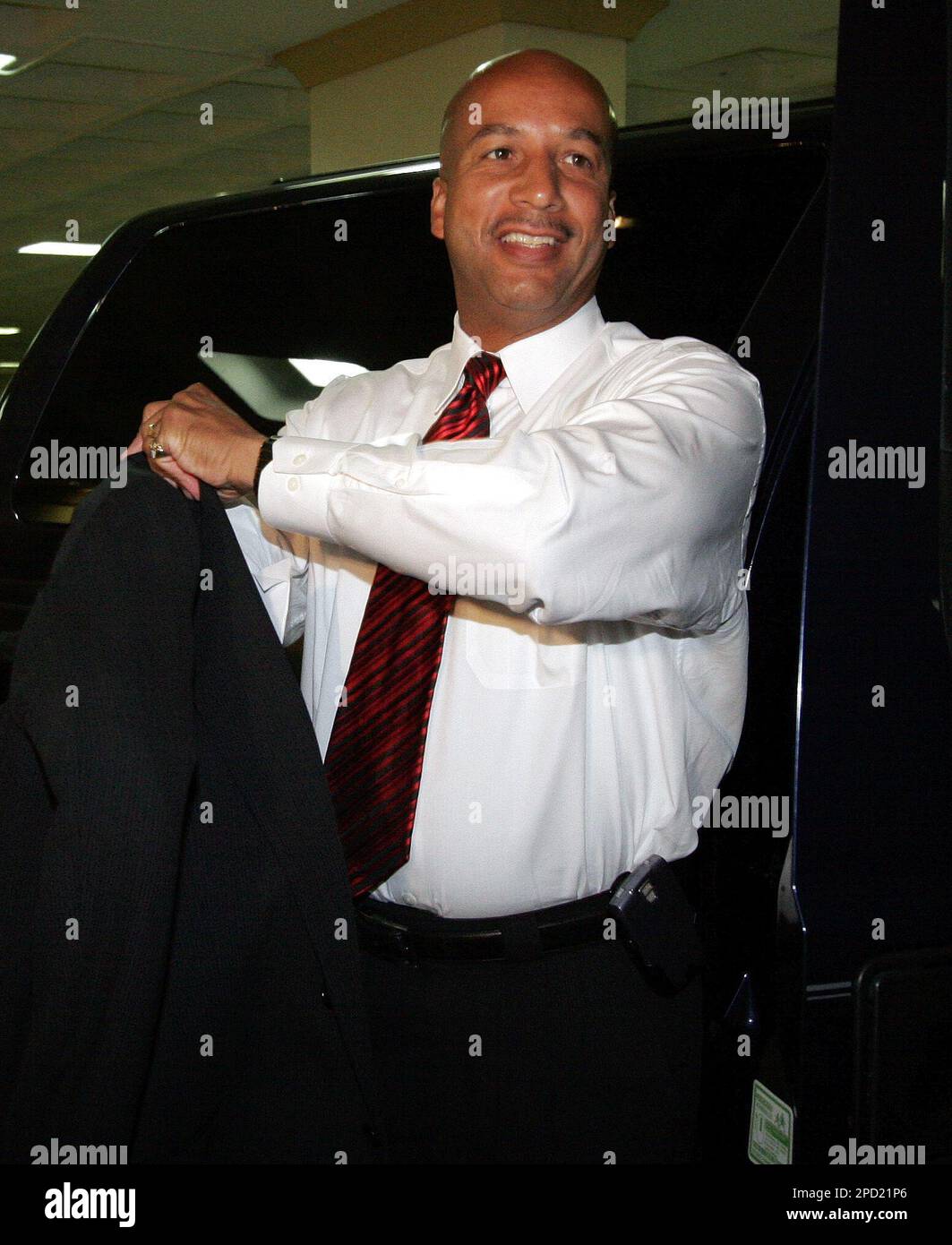 New Orleans Mayor Ray Nagin puts on his jacket as he arrives at his ...