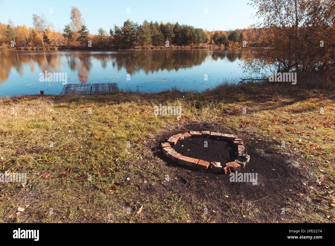 A brick circle for burning a bonfire located by the pond Stock Photo ...