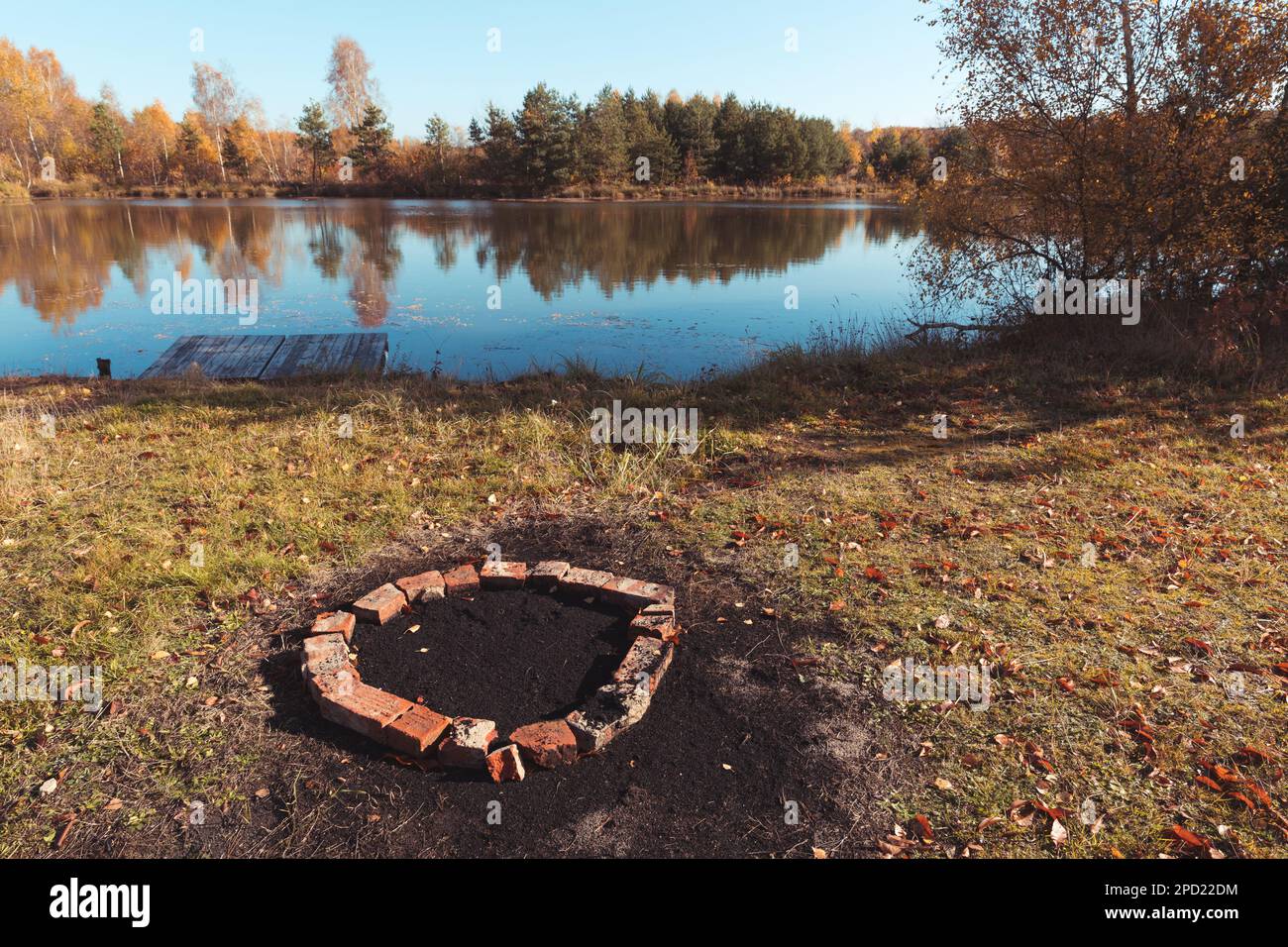 A brick circle for burning a bonfire located by the pond Stock Photo ...