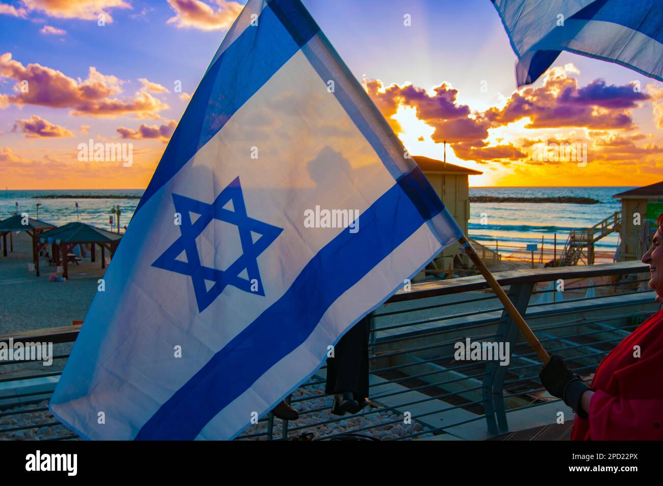 Blue and white Israeli flag waving in the wind with a Mediterranean Sun ...