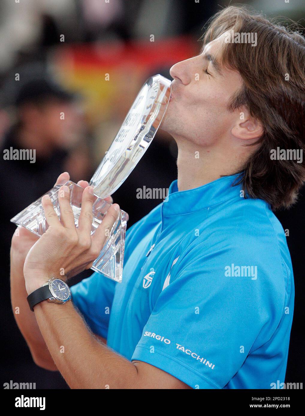 Tennis player Tommy Robredo of Spain kisses the trophy after winning ...