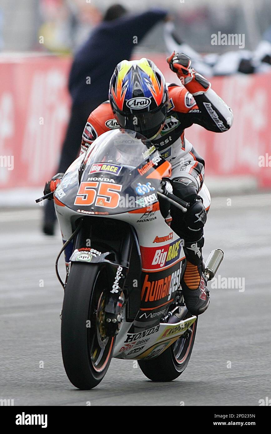 Japanese rider Yuki Takahashi jubilates on his Honda as he crosses the ...