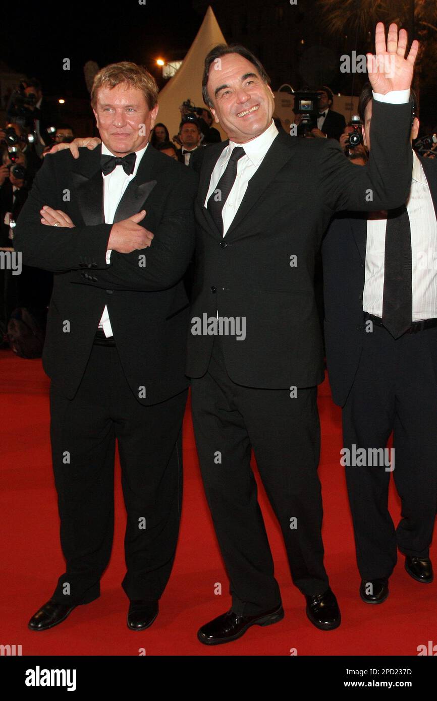 American actor Tom Berenger, left, and American director Oliver Stone ...