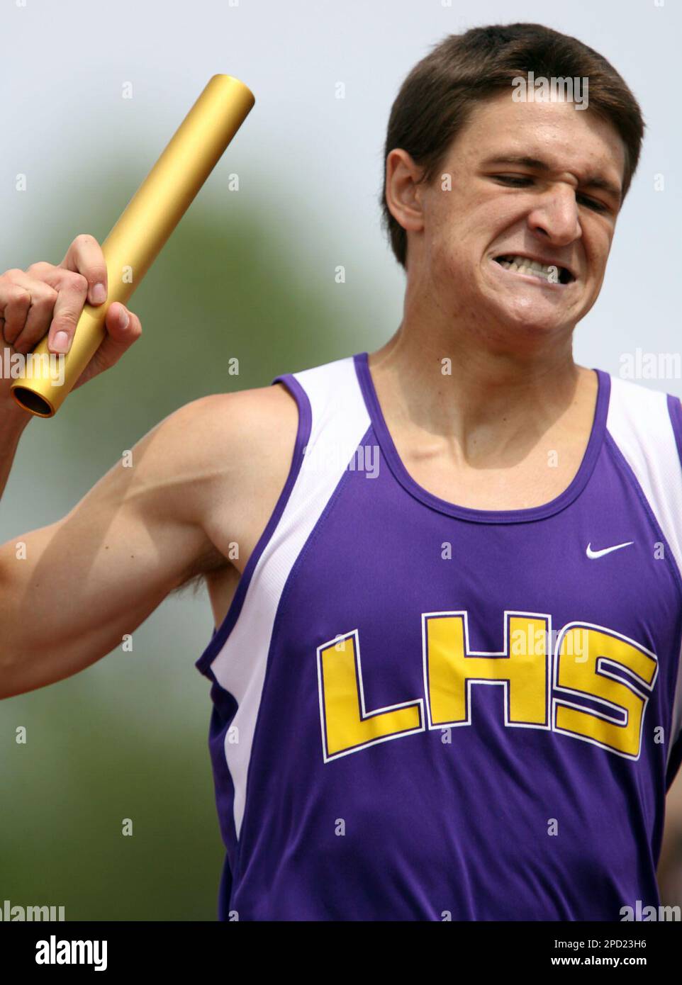 Littleton's J.T. Scheuerman reacts as he crosses the finish line to ...