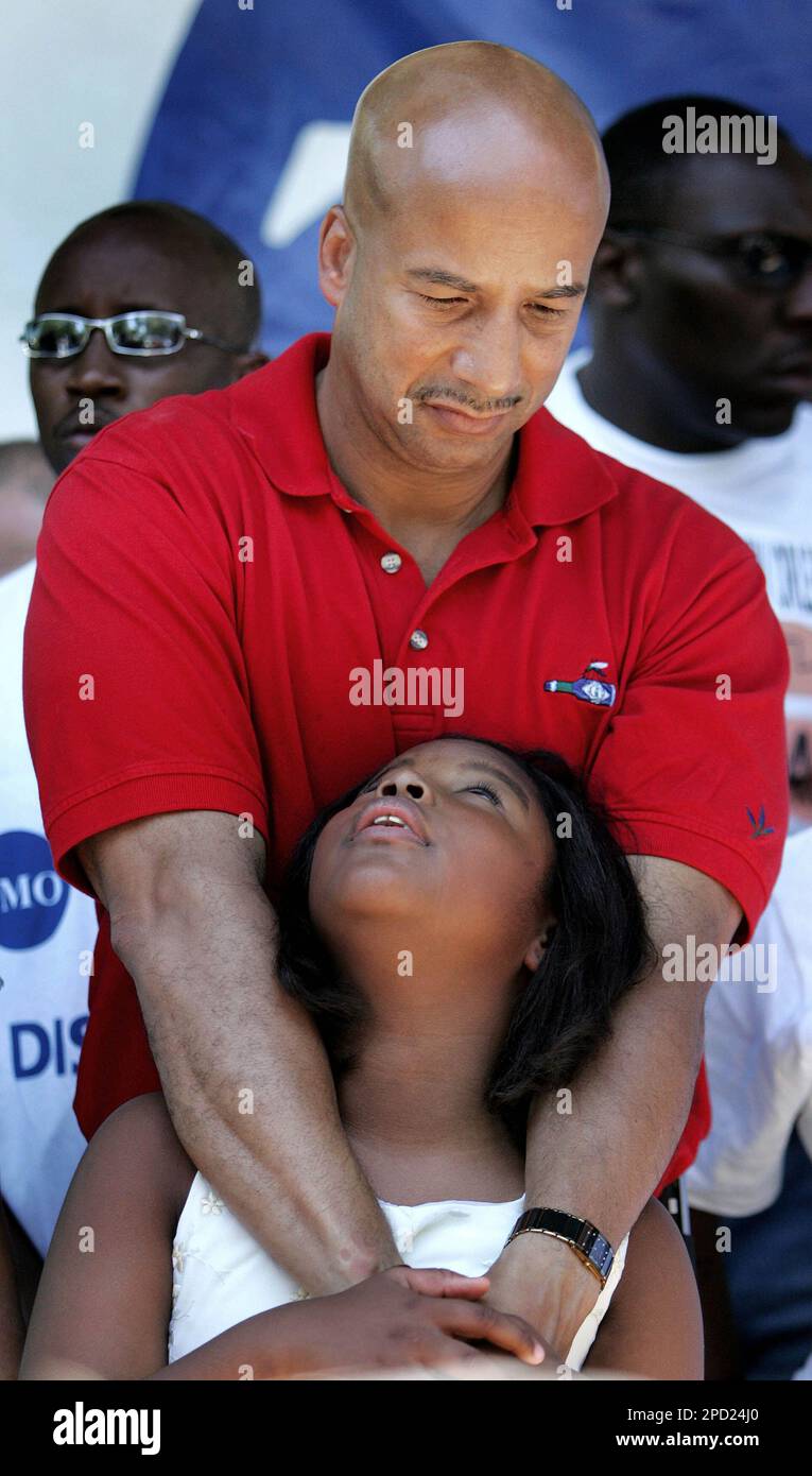 New Orleans Mayor Ray Nagin hugs his daughter Tianna during a campaign ...
