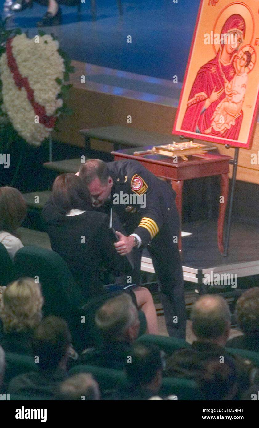 Fairfax County Chief of Police Col. David Rohrer hugs widow, Susan ...