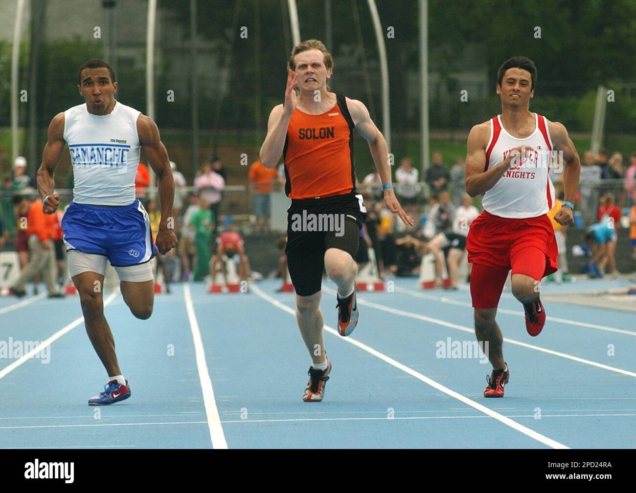 Solon's Travis Drahozal, center, wins the Class 2A Boys 100 Meter Dash ...