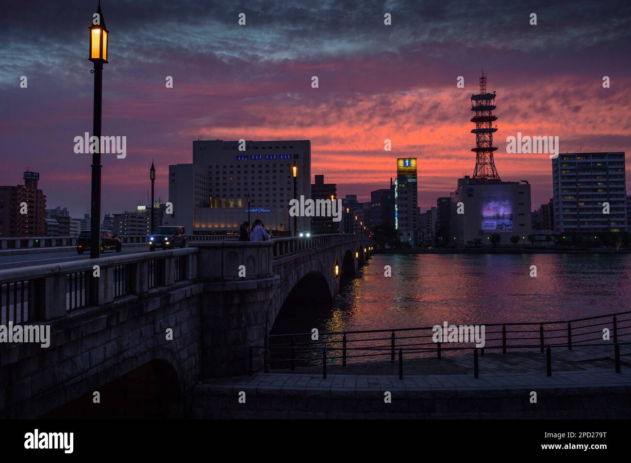 Bandai Bridge spans the Shinano River in Niigata City at dusk Stock ...