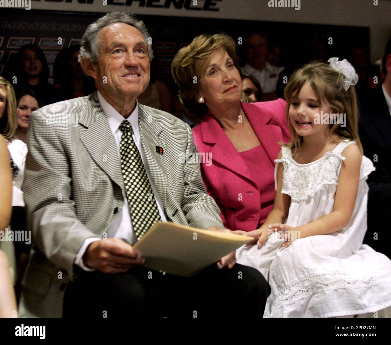 Oklahoma State men's basketball coach Eddie Sutton, left, smiles as he ...