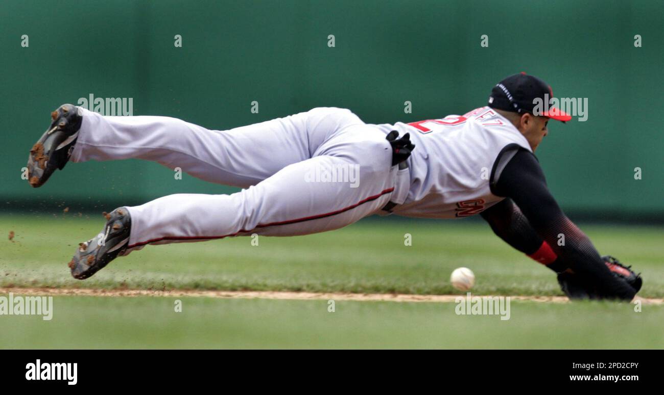 Cincinnati Reds shortstop Felipe Lopez can't get to a first-inning ...