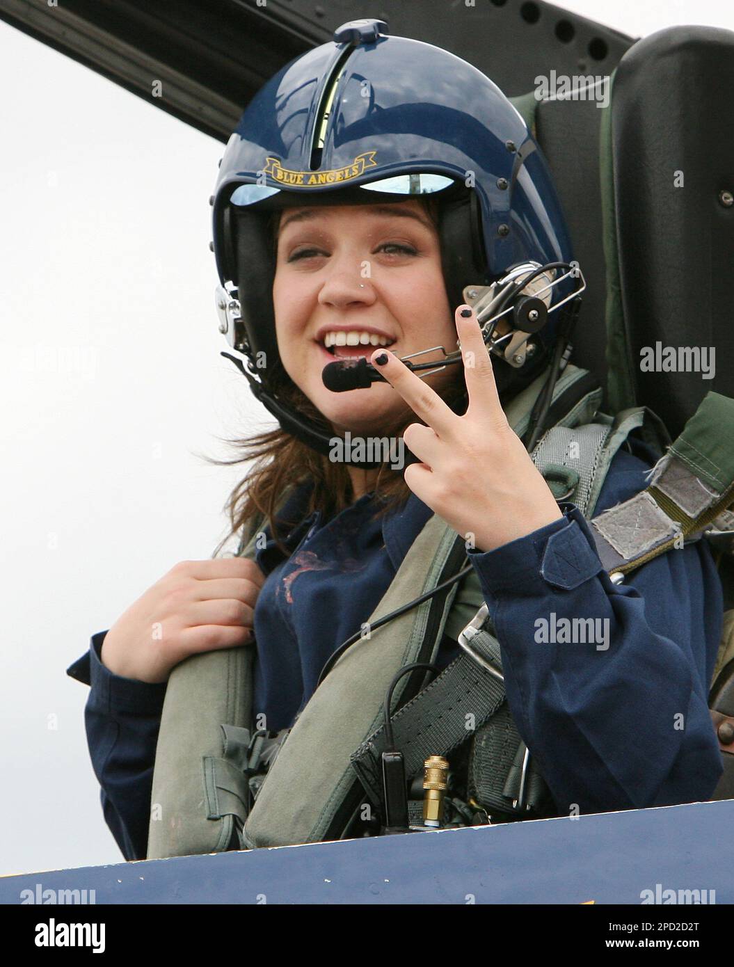 **FILE**Former "American Idol" winner Kelly Clarkson holds up two ...