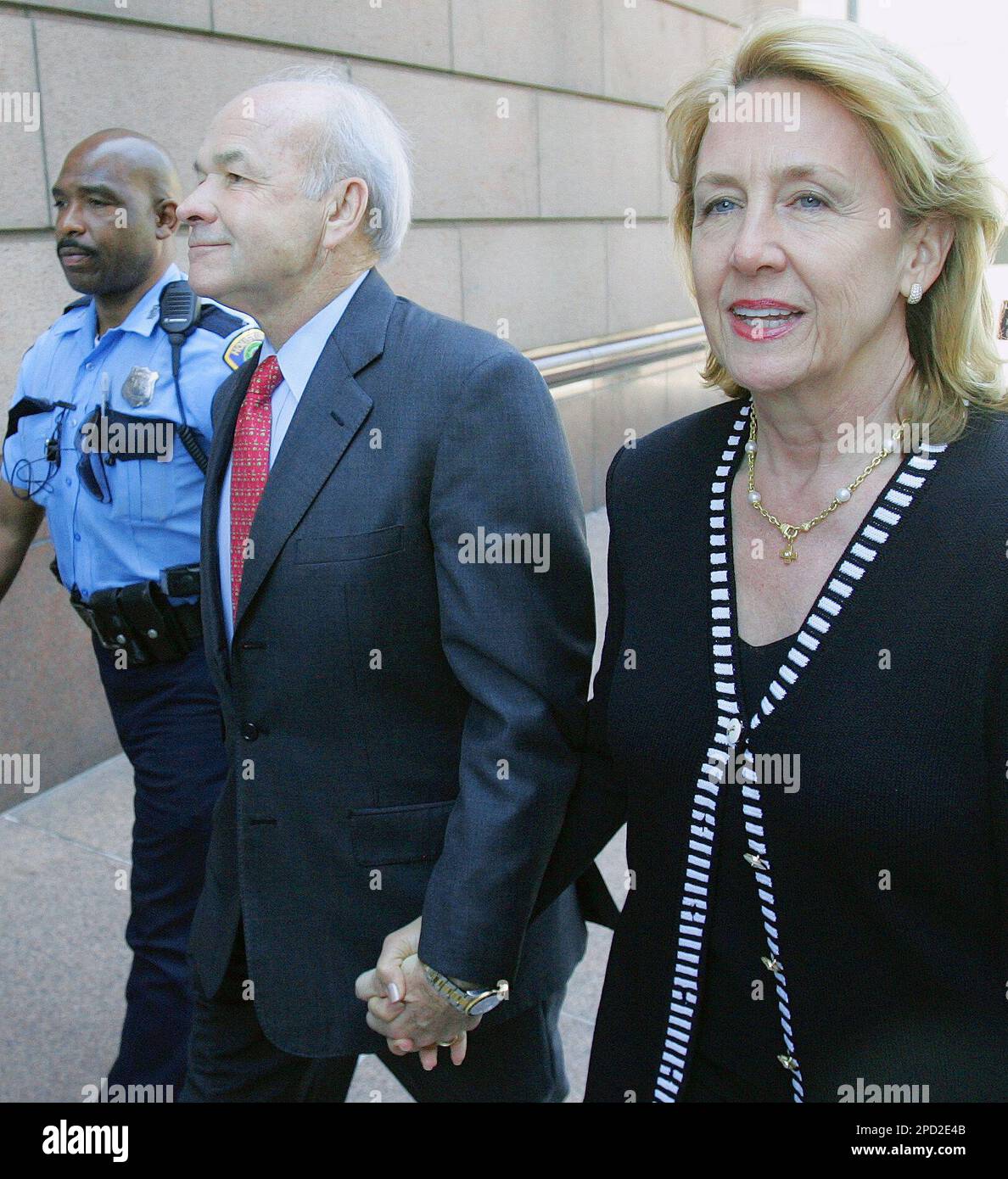 Enron founder Kenneth Lay, left, and his wife, Linda, are escorted by ...