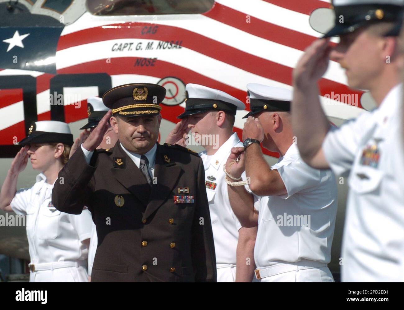Srecko Herzeg, a descendant of WW2 hero Peter Tomich, salutes during ...