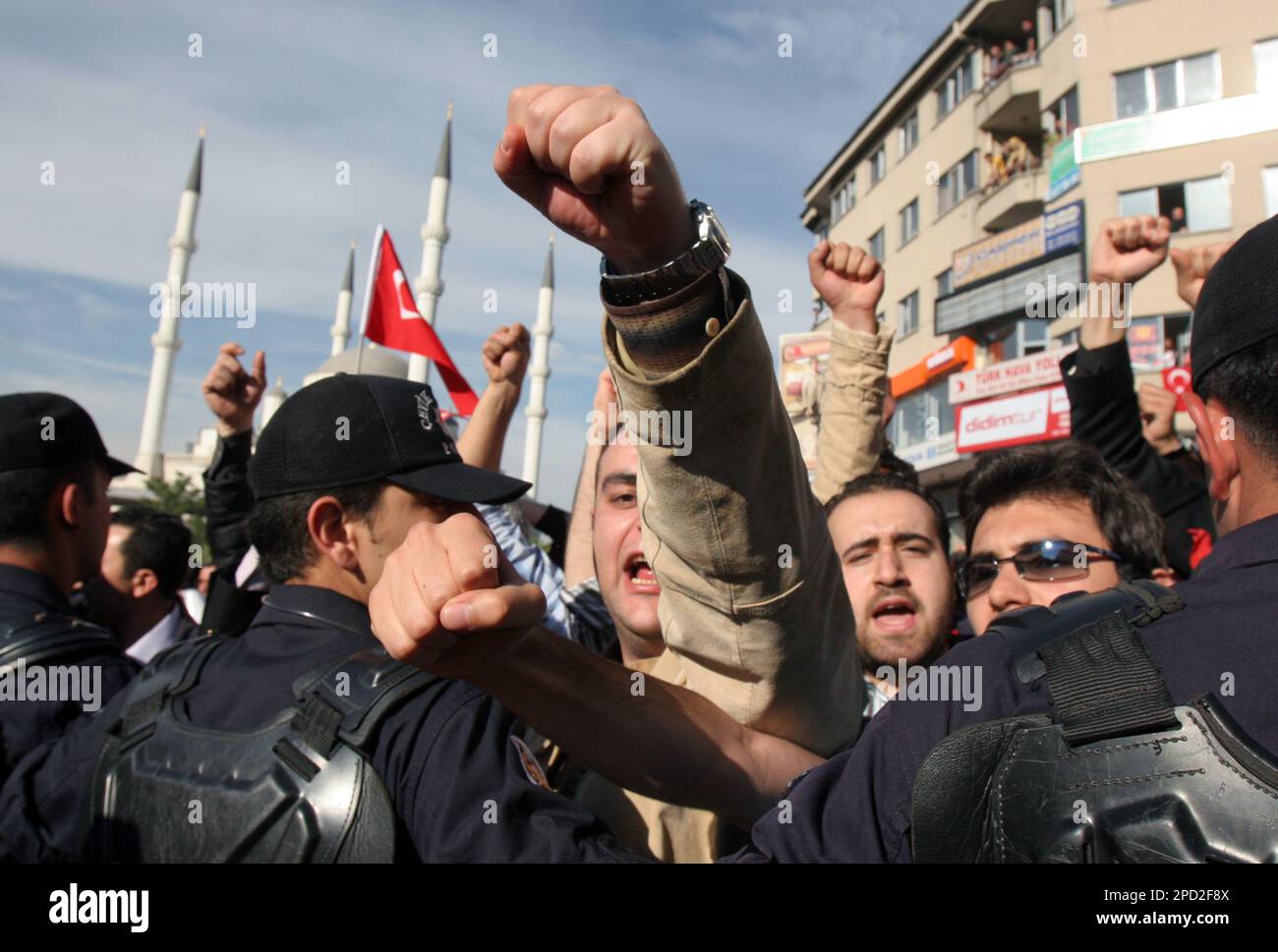 Riot police try to block angry Turks shouting slogans to protest ...