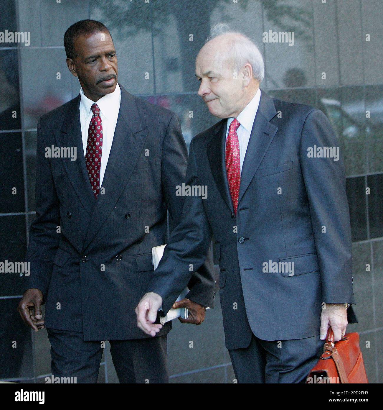 Enron founder Kenneth Lay, right, and Lee Perry enter the federal ...