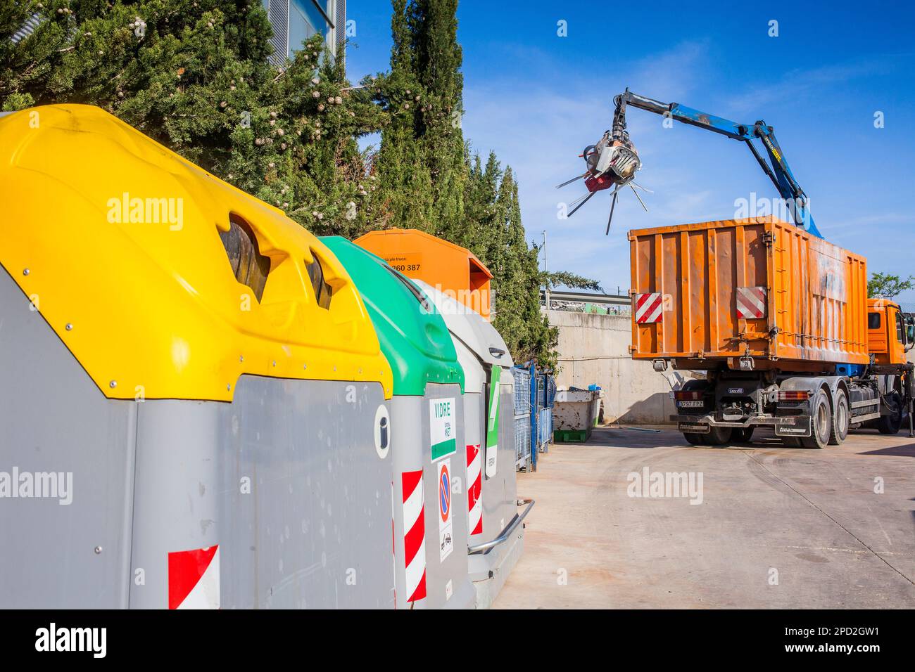 Containers for waste separation and lorry, recycling center Stock Photo ...