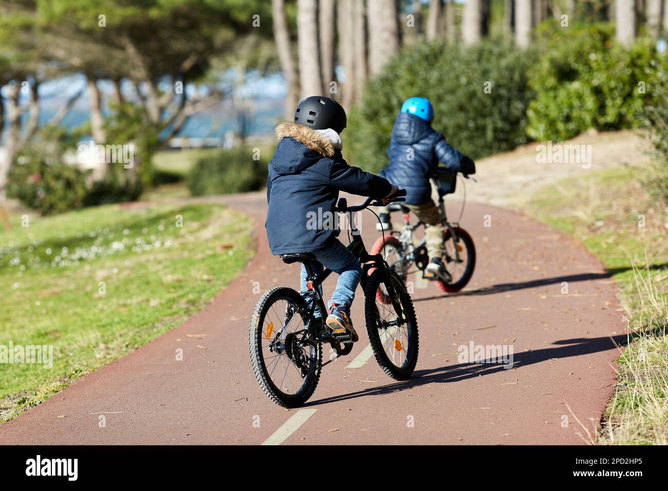 Caucasian boys riding bicycles hi-res stock photography and images - Alamy