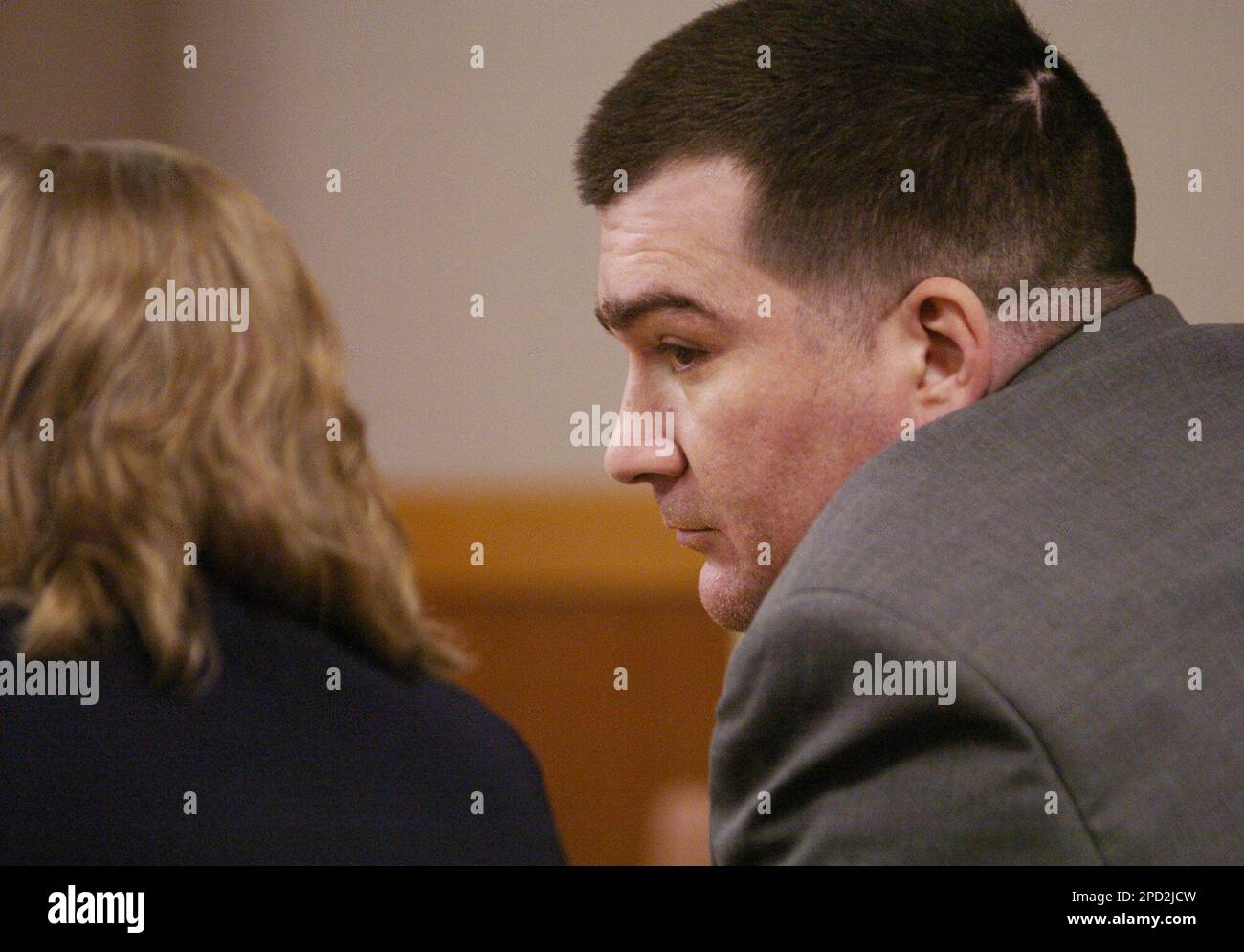 Jason Wheeler talks with defense attorney Liza Hammond during his trial ...