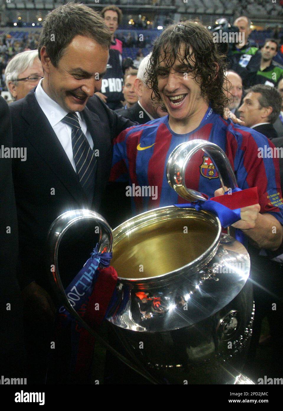 Barcelona's Carles Puyol, right, and Spanish Prime Minister Jose Luis ...