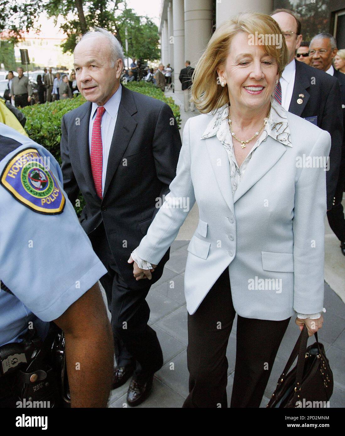 Enron founder Kenneth Lay, left, and his wife, Linda, leave the federal ...