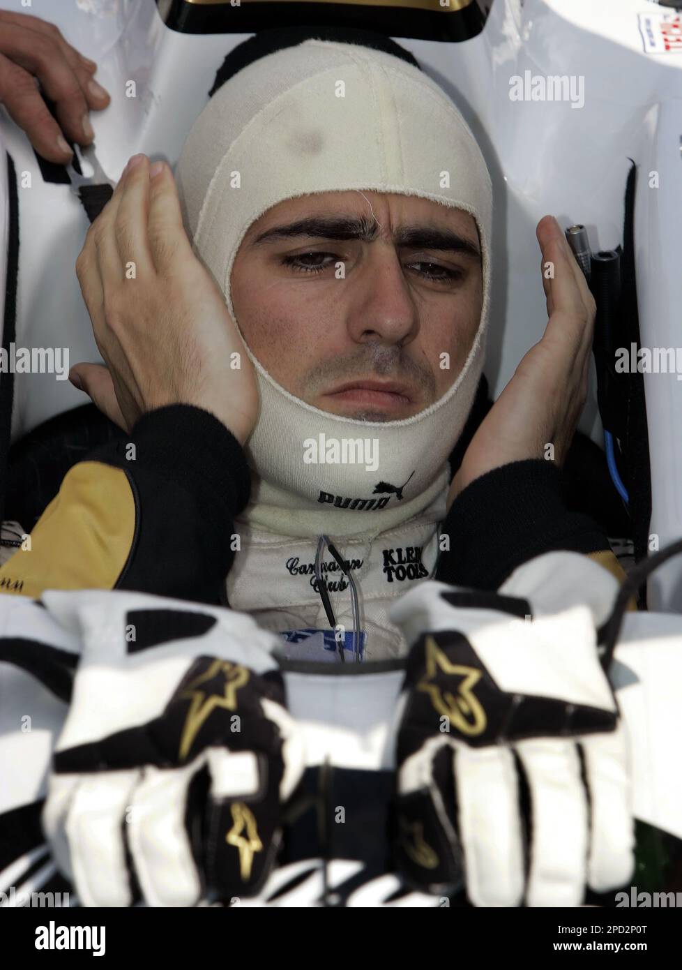 Indy Racing League driver Dario Franchitti of Scotland, adjusts his ...