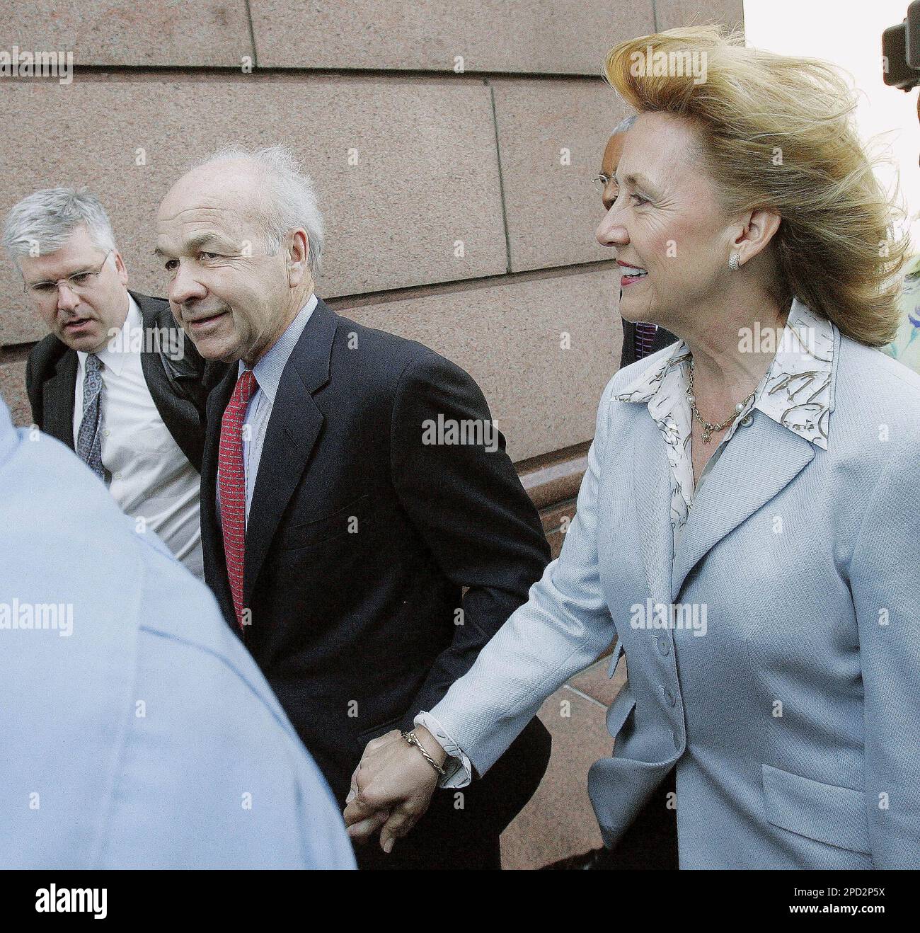 Enron founder Kenneth Lay, center, and his wife, Linda, right, leave ...