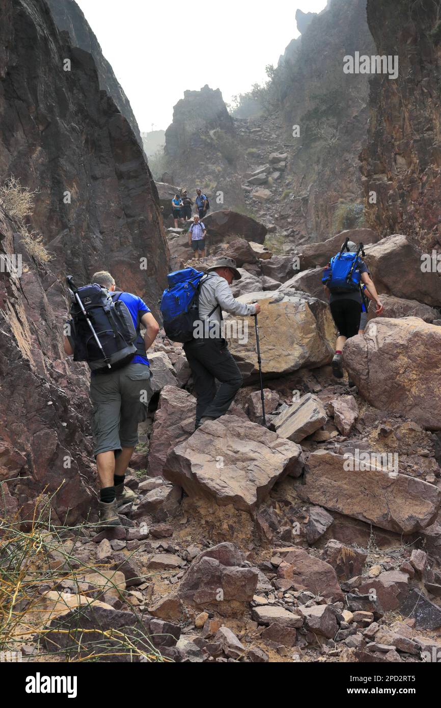 Walkers in the Naqad Gulley, Jabal Fied, Al-Sharat area of Jordan ...