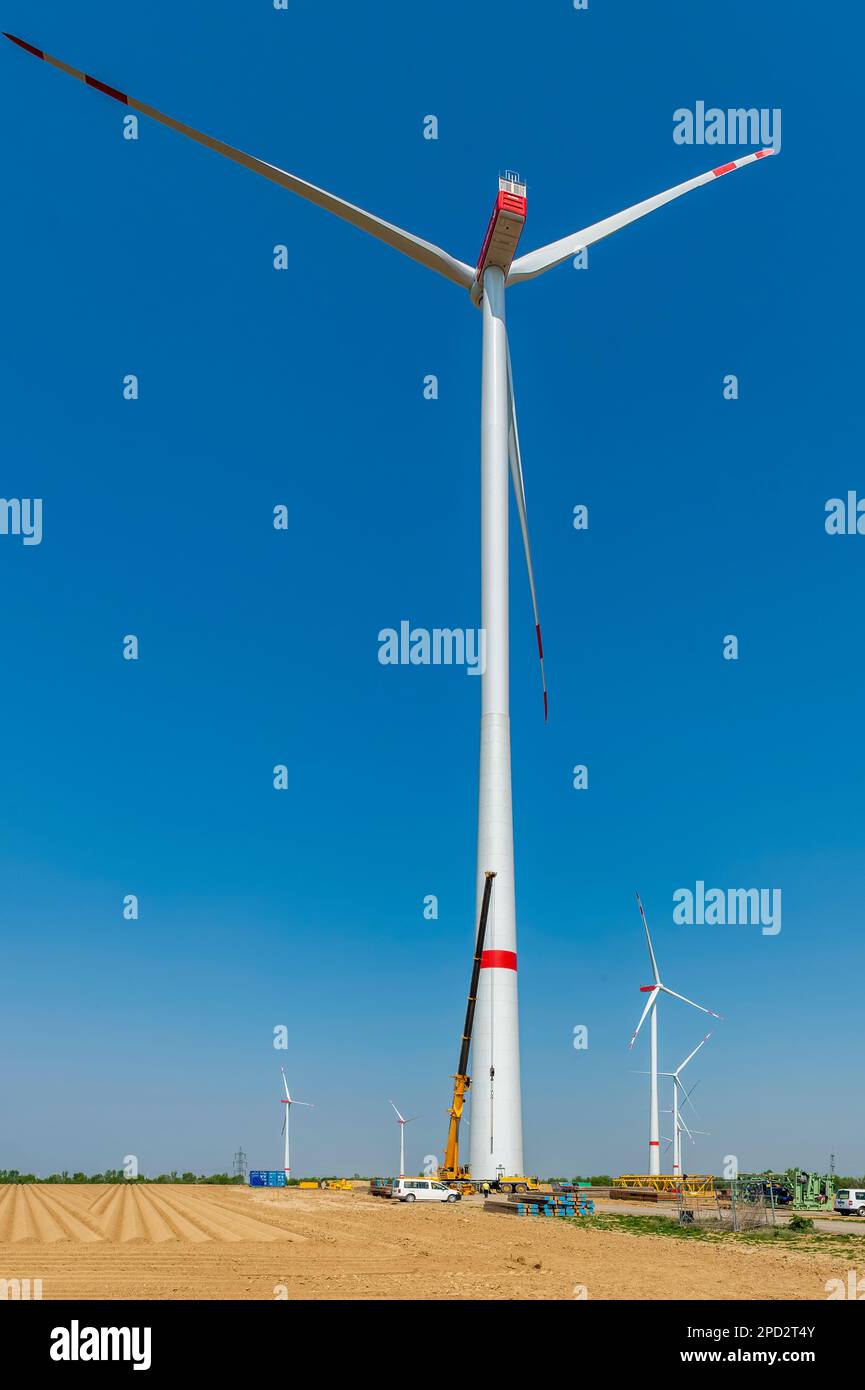 Wind Turbine And Crane Upright Stock Photo - Alamy