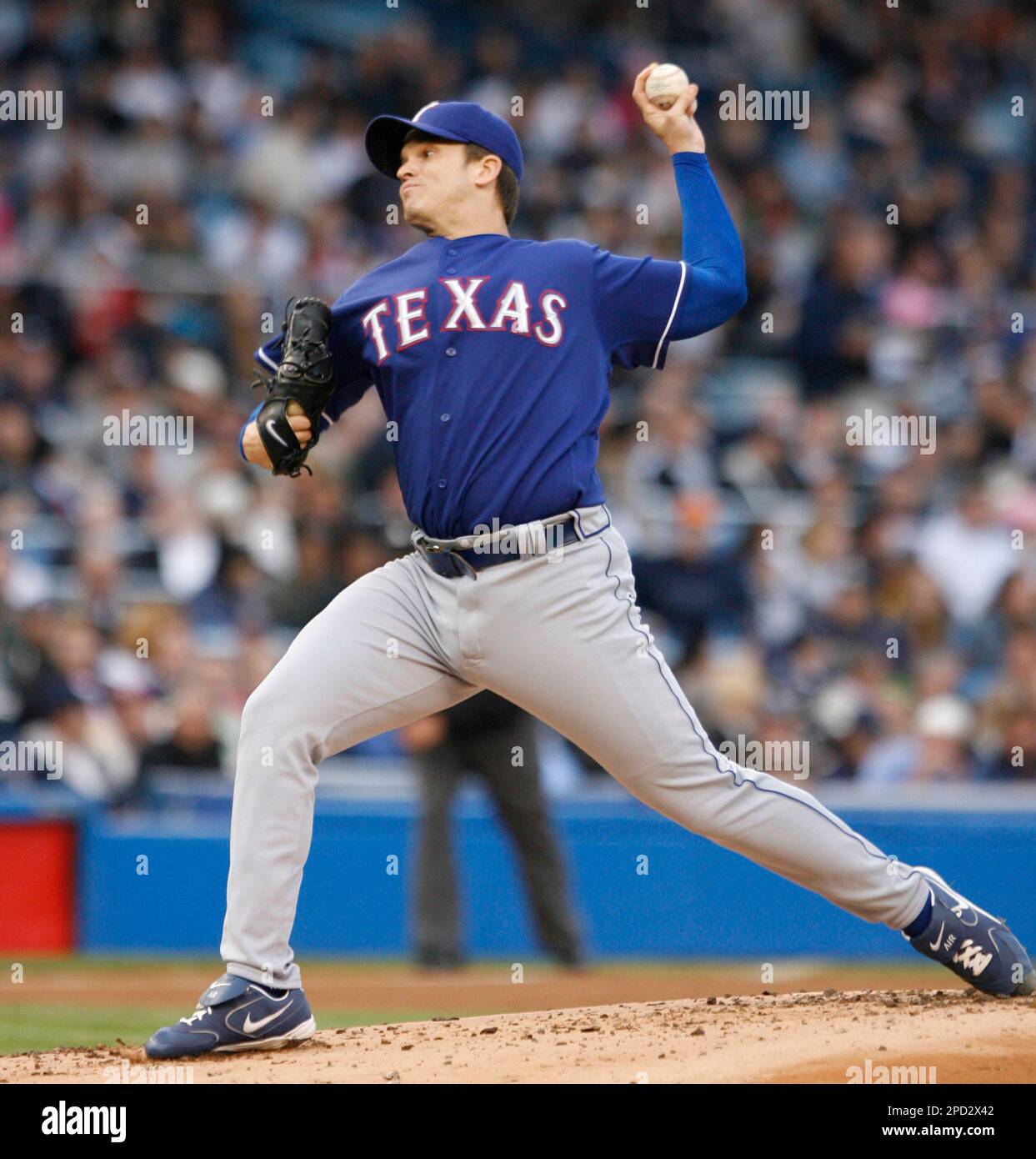 Texas Rangers pitcher John Koronka delivers a pitch in the first inning ...
