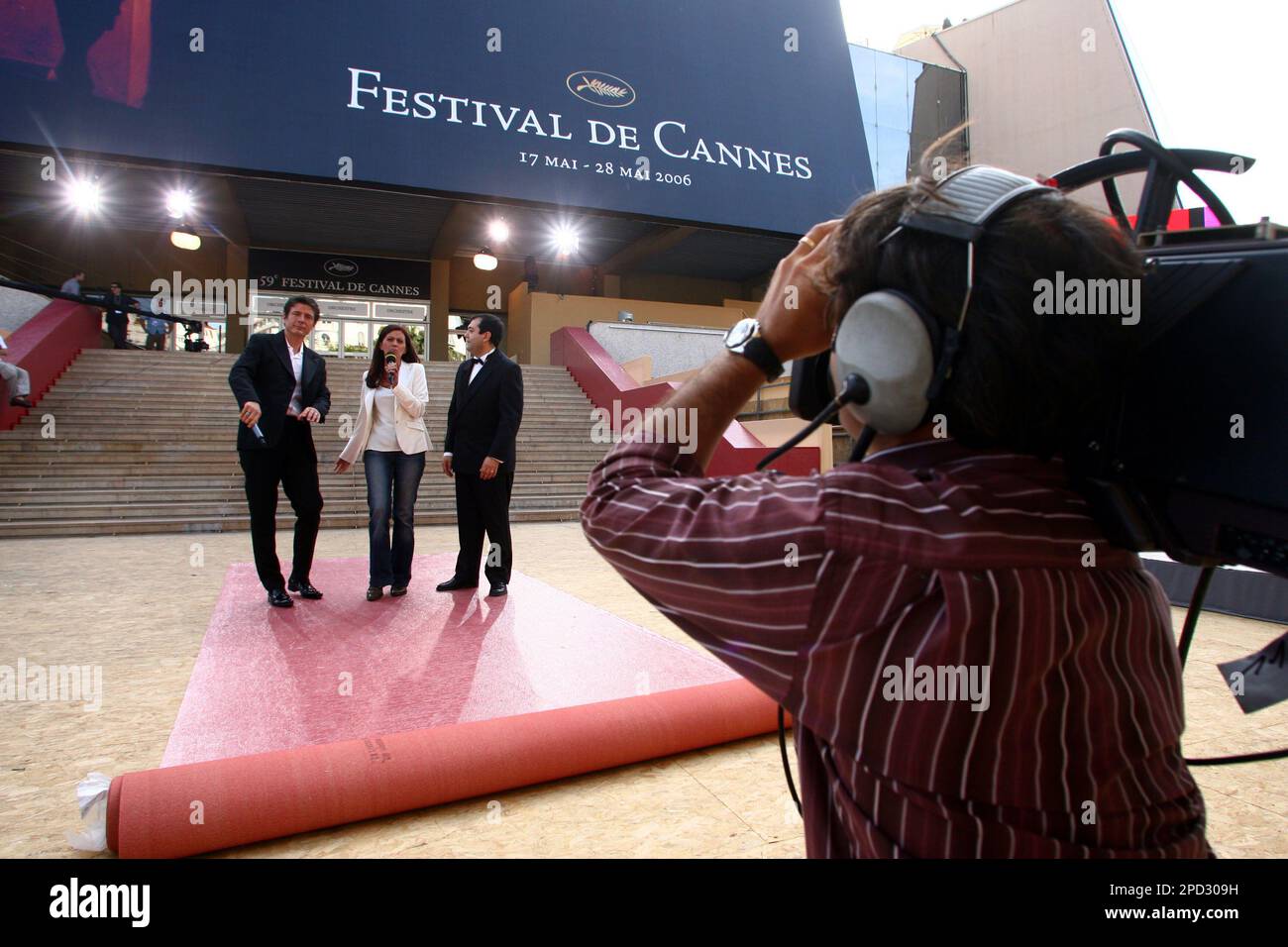 A cameraman of the Cannes Film Festival television channel takes ...